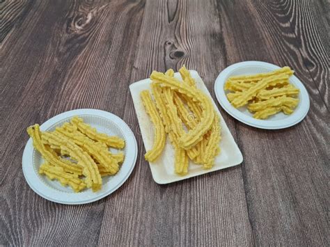 Crispy Yellow Crackers With A Savory Taste Can Be Eaten As A Snack Or