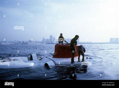 Crew Members Stand On The Hull Of The Us Navy Deep Submergence Vehicle Turtle Dsv 3 After A