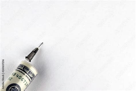 Financial Injections Money Entry A Banknote Of 100 Inside A Syringe
