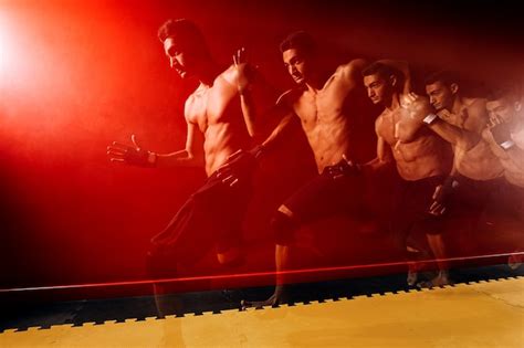 Premium Photo Dynamic Image Of A Running Athlete With A Naked Torso Against A Red Wall