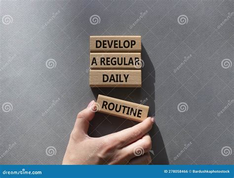 Develop A Regular Daily Routine Symbol Concept Words Develop A Regular Daily Routine On Wooden