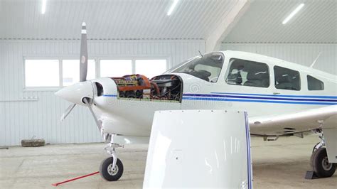 Single Engine Propeller Airplanes Parked In A Closed Aircraft Hangar