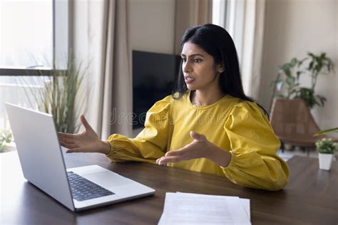 Concerned Indian Freelance Worker Woman Looking At Wrong Working Laptop