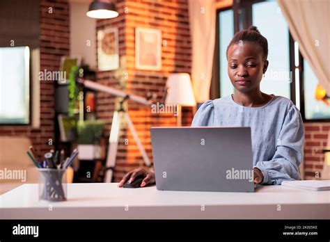 Successful Businesswoman Typing On Laptop And Working In Modern Home