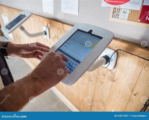 Man Using A Small Sized Terminal Editorial Photography Image Of