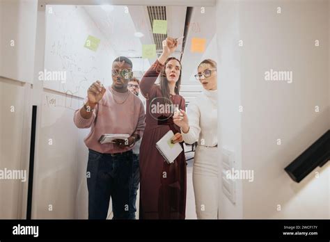 Successful Business Team Collaborating And Strategizing In A Pleasant