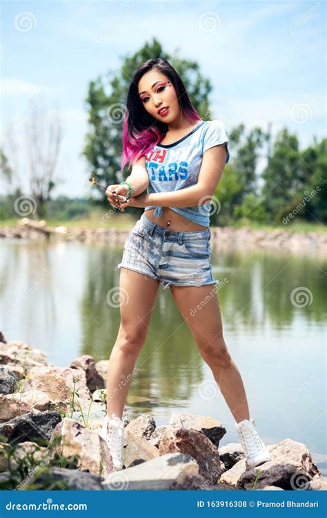 Beautiful Asian Girl Posing In The American Independence Day Stock
