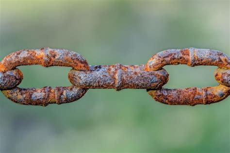 Close Up Of A Rusted Chain With A Blurred Background Premium AI Generated Image