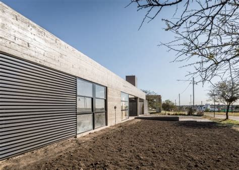 House By Tectum Features Raw Concrete Walls And Black Metal