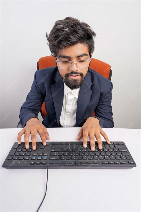 Premium Photo Indian Man In Glasses Working At The Computer His Hands