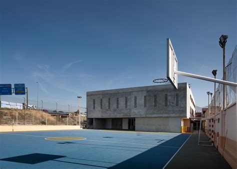 Circular Perforations Create Spotlights In Granada School