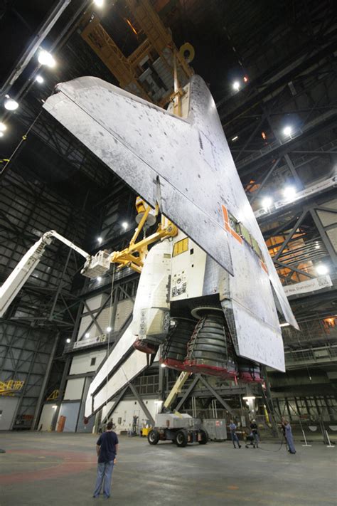 Space Shuttle Discovery Is Hoisted And Mated To The External Fuel Tank