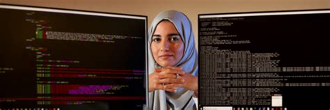 woman between two computers information technology solutions