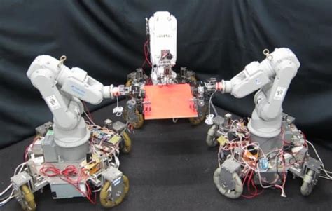 Cooperative System Consisting Of Three Industrial Manipulators With