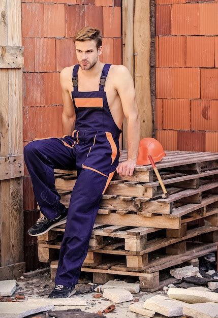 Premium Photo Sexy Laborer Building Construction Worker Brick Wall Background Man Build Own