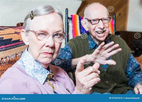 Angry Grandpa Scolding Grandson For Playing Video Game On Tablet
