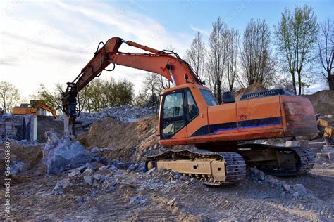 Crawler Excavator With Hydraulic Breaker Hammer For The Destruction Of Concrete And Hard Rock At