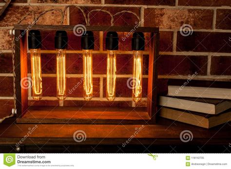 Light Bulb Lamp On Dark Red Brick Background With Hotspot Close Up Loft Stock Image Image Of