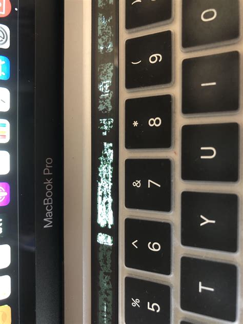 please help me how to fix my macbook pro m1 touch bar pixelated r