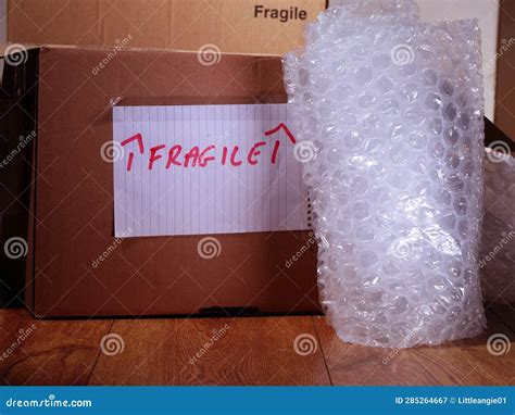 Moving Fragile Items With Cardboard Boxes And Bubble Wrap Stock Image Image Of Wrapping