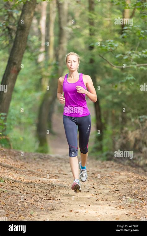Pretty Young Girl Runner In The Forest Running Woman Female Runner Jogging During Outdoor