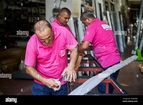 Workers Packing Cardboard Box In Warehouse For Shipment An Operator