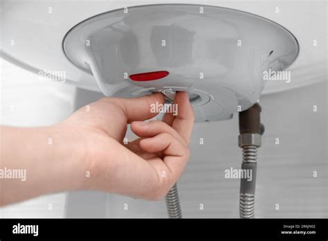 Woman Adjusting Maximum Energy Efficiency Indicator Indoors Closeup Boiler Installation Stock