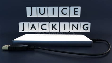 Cubes Labeled Juice Jacking And A Smartphone Connected To A Charging
