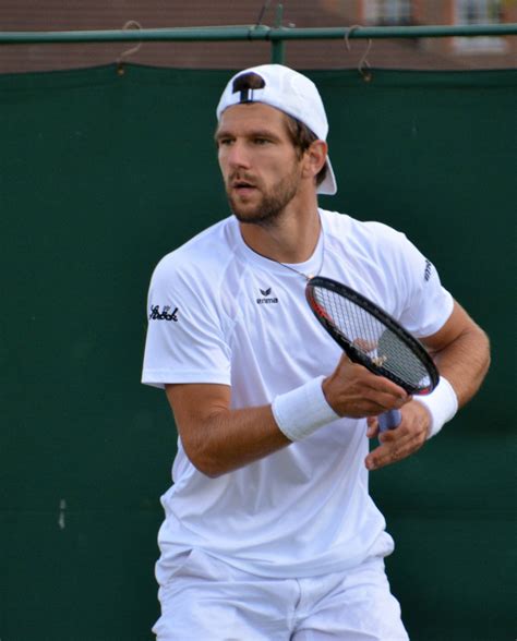 Download Jurgen Melzer Holding His Tennis Racket Wallpaper