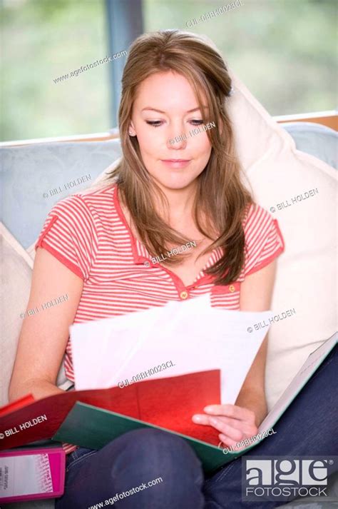 A Female Checking Some Notes Stock Photo Picture And Royalty Free Image Pic CUL 08BH0023CL