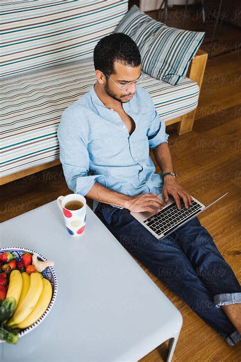 Man Typing On His Laptop By Stocksy Contributor Michela Ravasio Stocksy