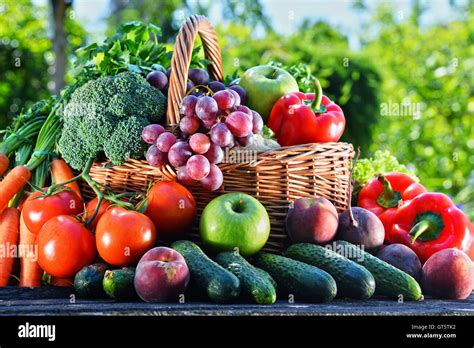 Variety Of Fresh Organic Vegetables And Fruits In The Garden Balanced