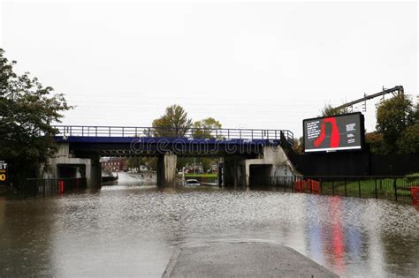 An Underpass Is Shown That Has Flood In It While It Is Raining