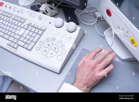 Doctor Using Laptop And Electronic Medical Record Emr System Digital Database Of Patients