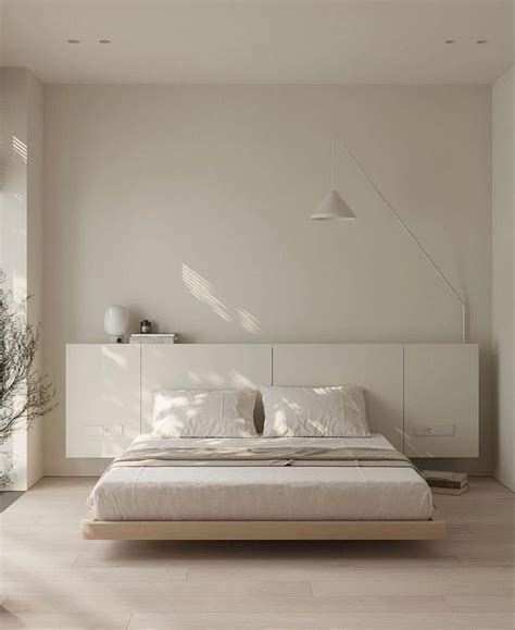 Minimalist Bedroom Design With White Bed And Wall Light