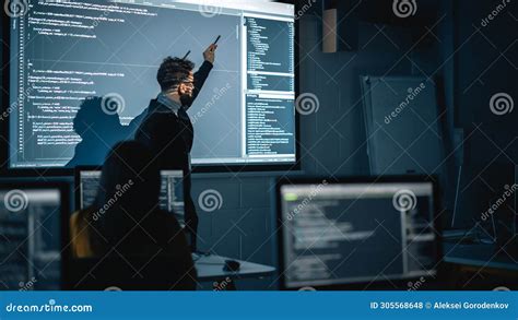 Teacher Giving Computer Science Lecture To Diverse Multiethnic Group Of