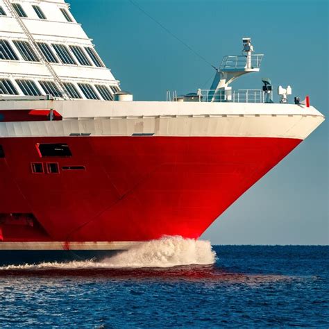 Premium Photo Red Ship Sailing In Sea Against Clear Sky