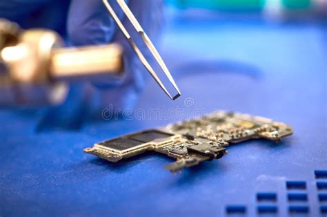 Smartphone Repair Tweezers With Microchip At Mobile Phone Repairing