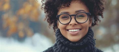 A Woman In Glasses Smiling At The Camera Premium Ai Generated Image