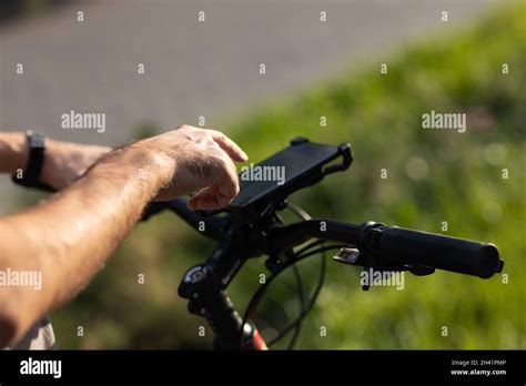 Man Planning Route Using Gps Navigation Application In Mobile Phone On
