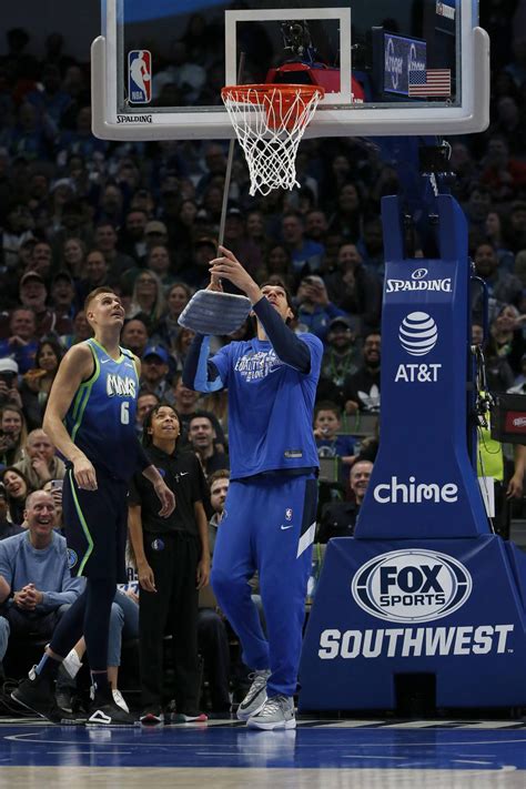 Boban Holding A Sweat Mop Helping Shorter Teammate Retrieve A Stuck Ball R Bobanholdingthings
