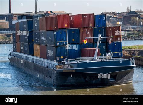Container Cargo Ship Enters The Harbour Basin Of The Logport Container