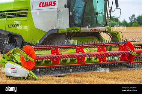 Class 750 Lexion Combine Harvesters Parked Up On A Stubble Field