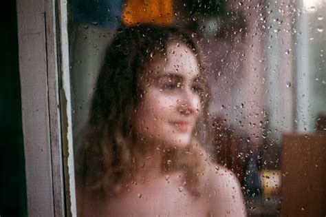 Premium Photo Beautiful Woman Seen Through Wet Window