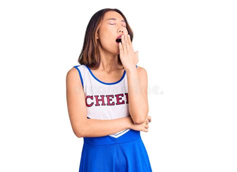 Young Beautiful Chinese Girl Wearing Cheerleader Uniform Bored Yawning