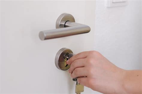 Premium Photo Hand Of Woman Opening Door With House Keys