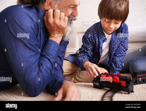 He Loves Spending Time With His Grandson A Grandfather Watching His