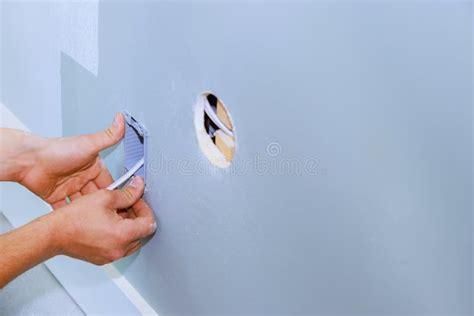 An Electrician Installed A New Current Socket During Renovation Of In Apartment Stock Image An Electrician Installed A New Current Socket During Renovation Of In Apartment Stock Image