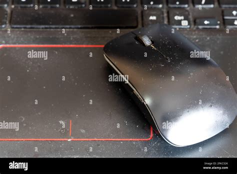 Close Up On Dirty And Unhygienic Computer Laptop Mouse And Keyboard Full Of Dust And Particles