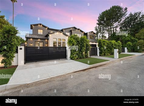 Modern Luxury House With Black Exterior Large Windows And A Gated